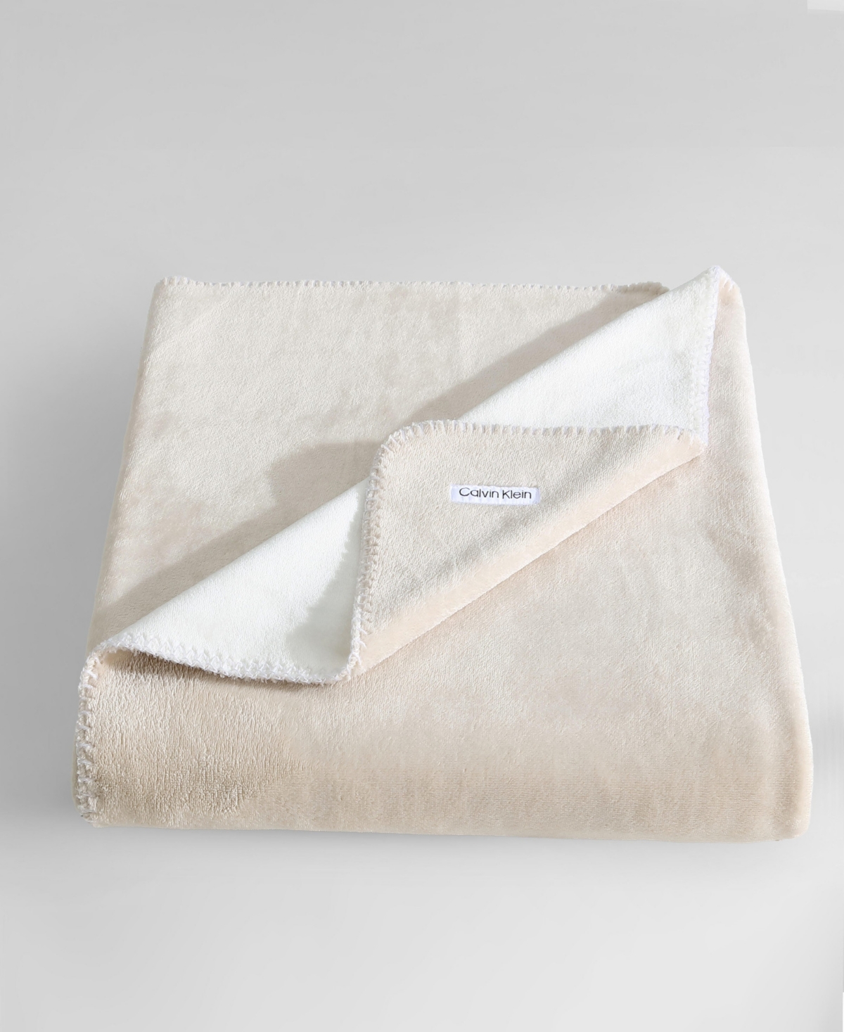 Click here for Calvin Klein Modern Solid Reversible Throw  70 X 5... prices