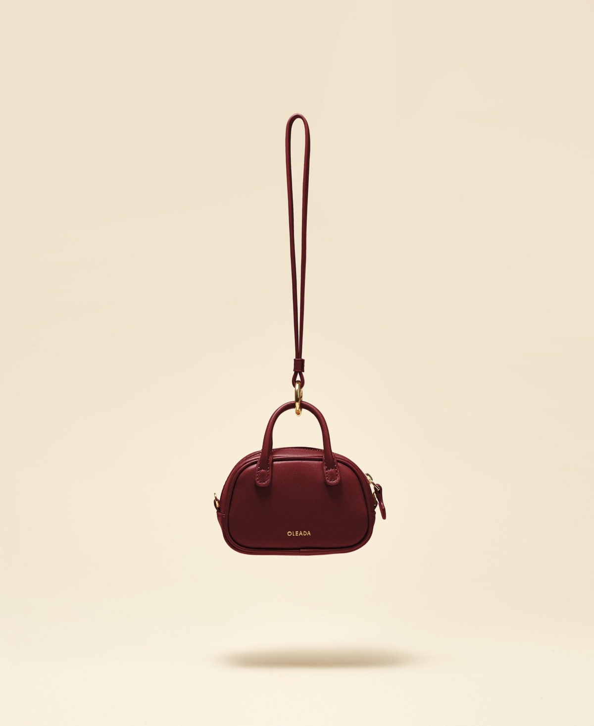 Click here for Oleada Mini Marina Carryall Charm - Scarlet prices