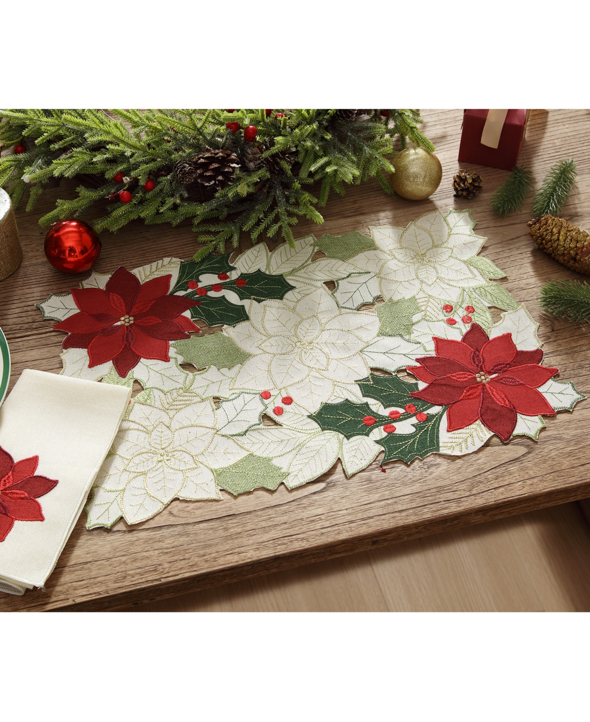 Click here for Elrene Poinsettia Cutwork Rectangle Fabric Placema... prices
