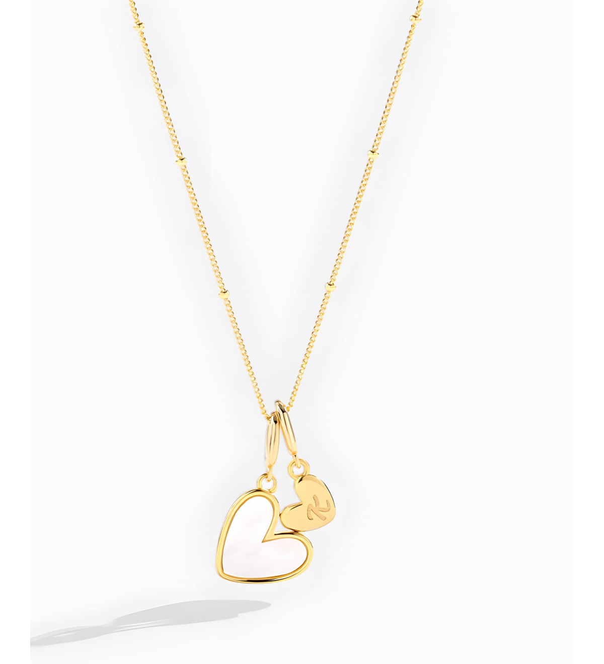 Click here for Mint & Lily Mother Of Pearl Heart Initial Necklace... prices