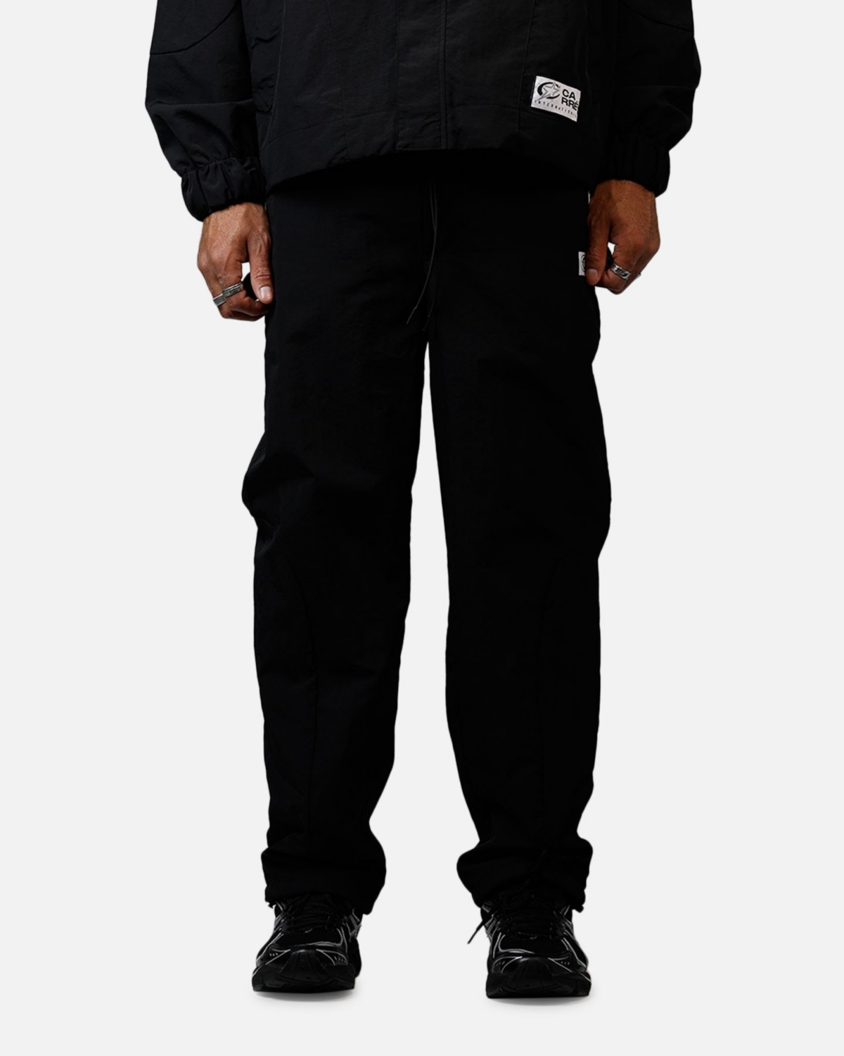 Click here for Carre Mens Sprint Panelled Nylon Joggers - Black prices