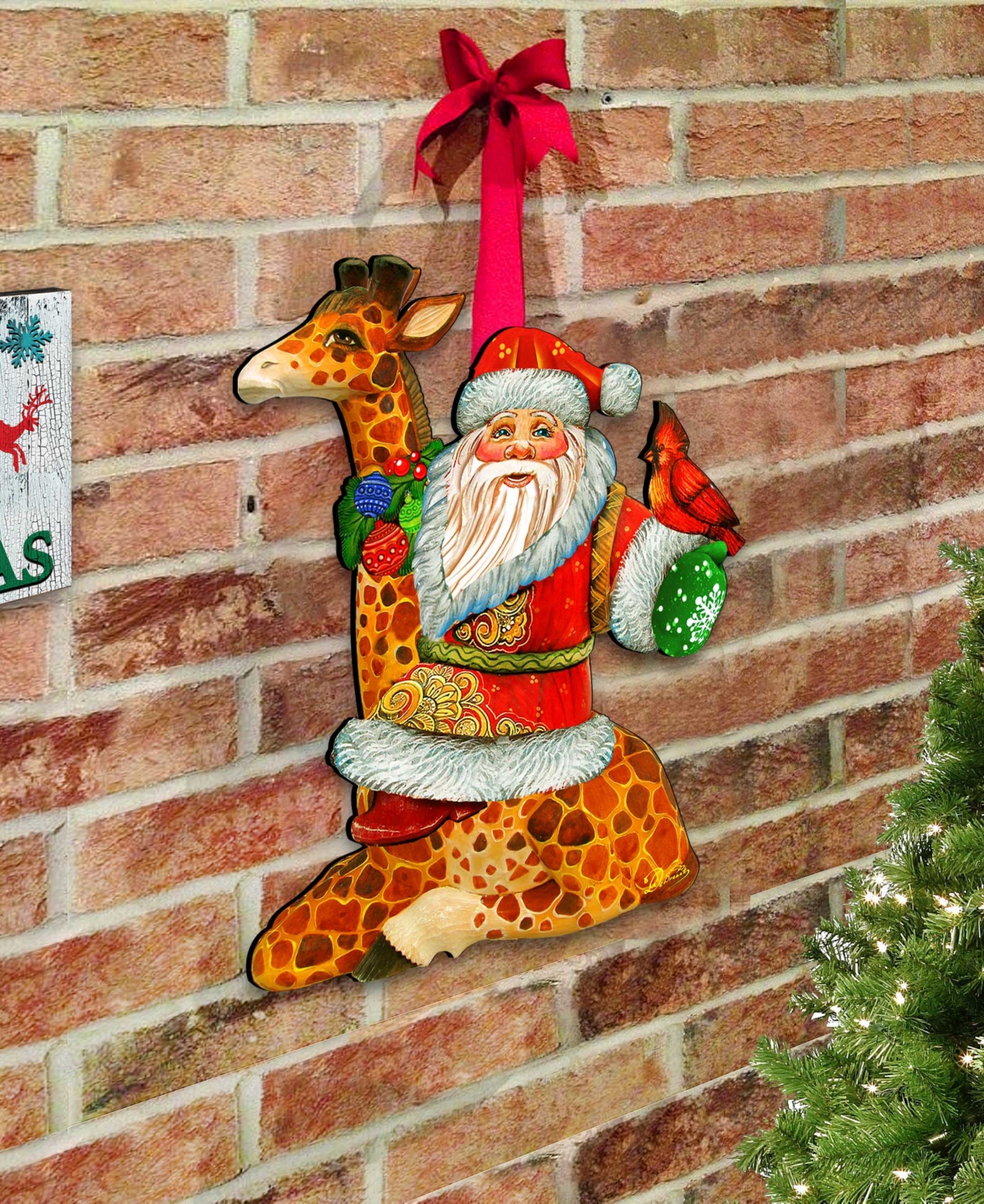 Click here for Designocracy Santa on Giraffe Christmas Door Hange... prices