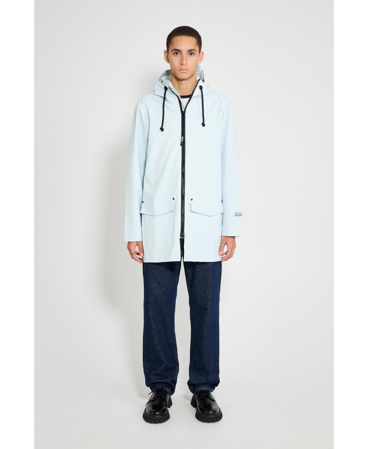 Click here for Stutterheim Mens Stockholm Patch Matte Raincoat -... prices