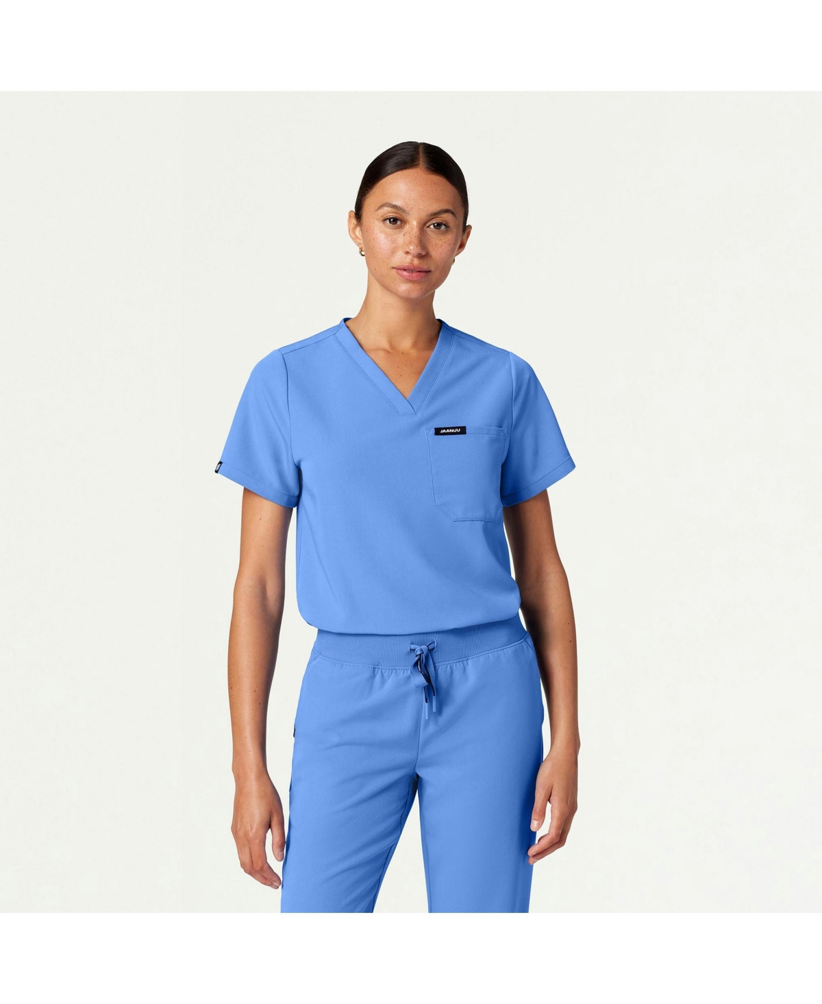 Click here for Jaanuu Plus Size Rhena 1-Pocket Classic V-Neck Scr... prices