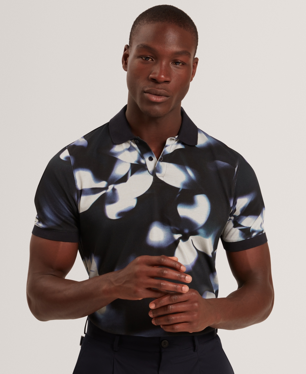 Click here for Ted Baker Mens Floral Printed Polo Shirt - Black prices