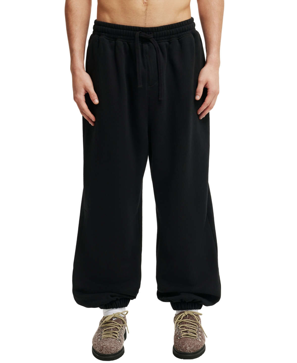 Click here for Cotton On Mens Baggy Cuffed Track Pants - Black prices