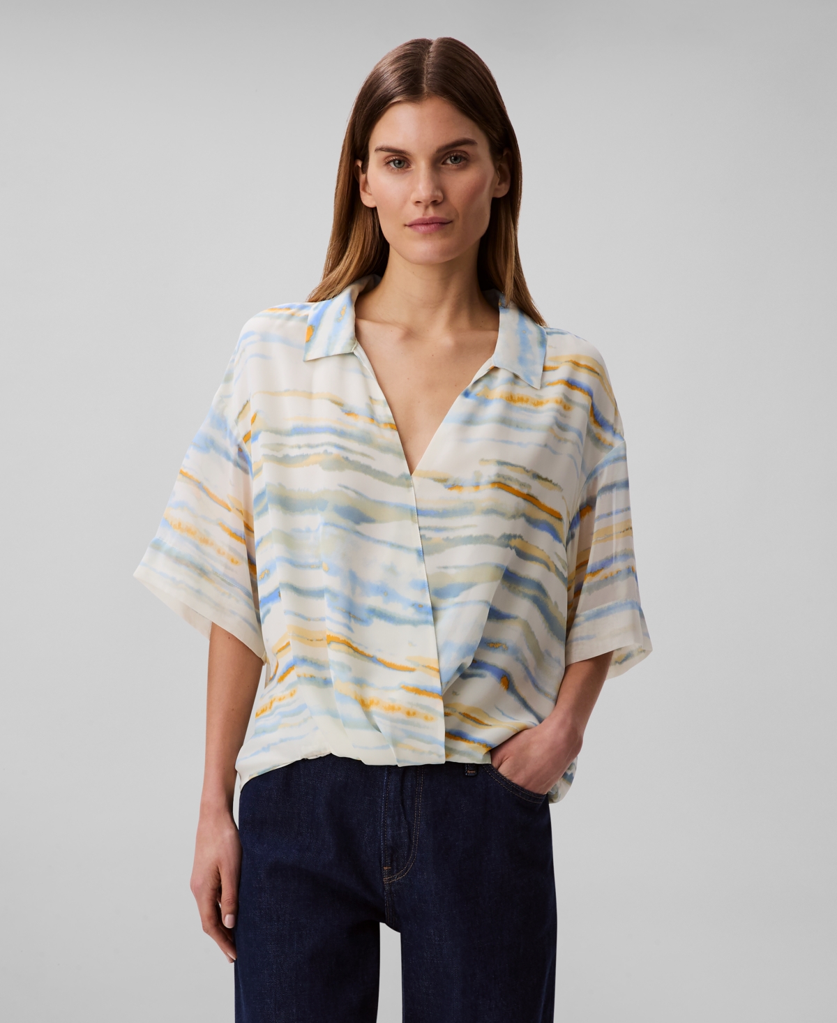Click here for Calvin Klein Womens Printed V-Neck Faux-Wrap Blous... prices