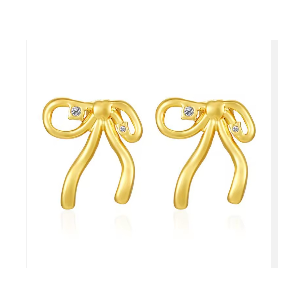 Click here for Rebl Jewelry Crystal Bow Stud Earrings - Gold prices