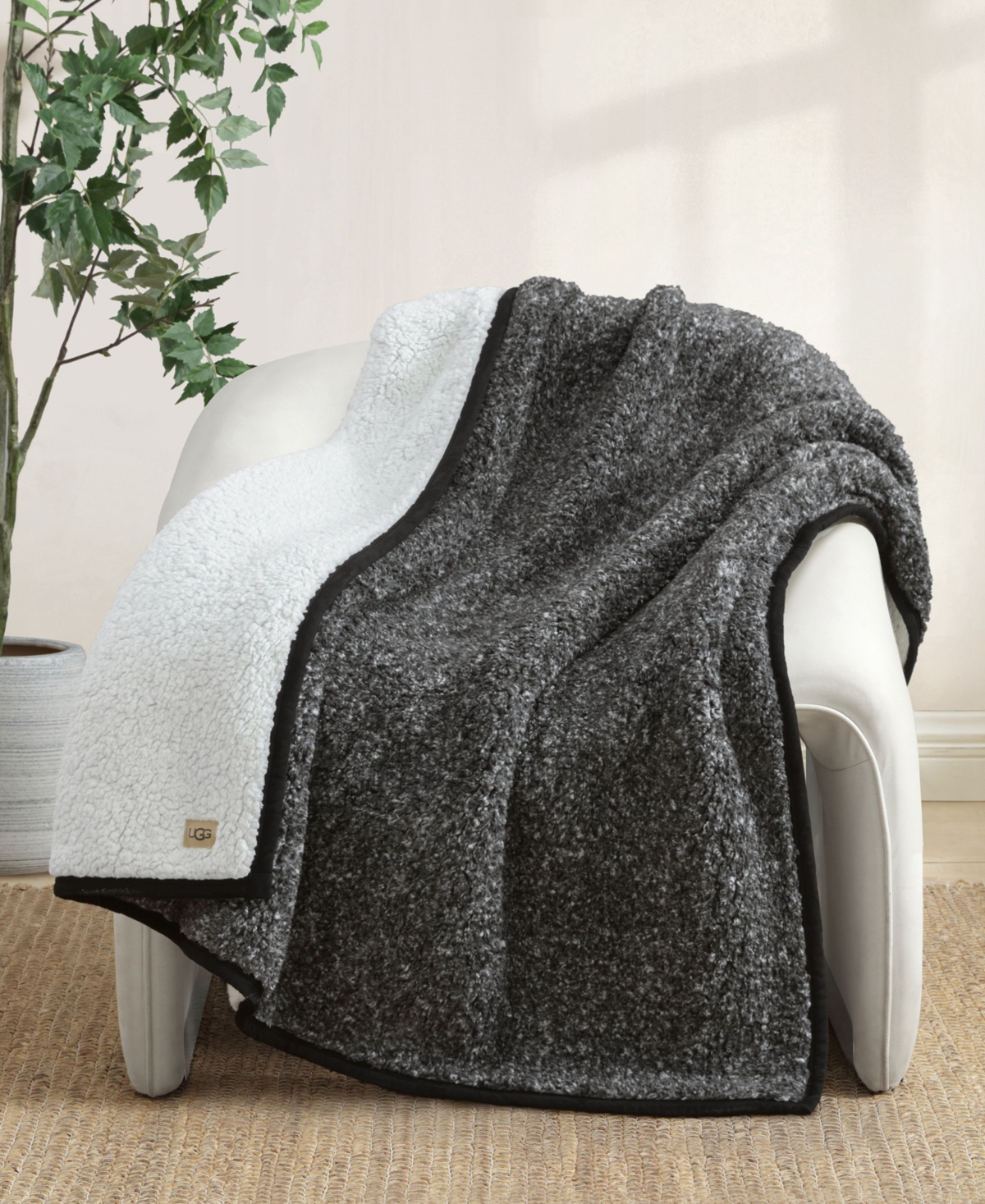 Click here for Ugg Classic UGGfluff Throw  50 x 70 - Off Black prices